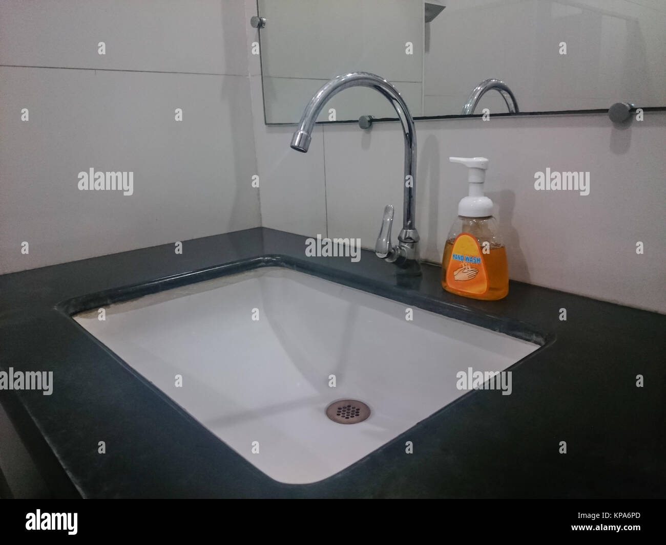 enamel basin in restroom Stock Photo - Alamy