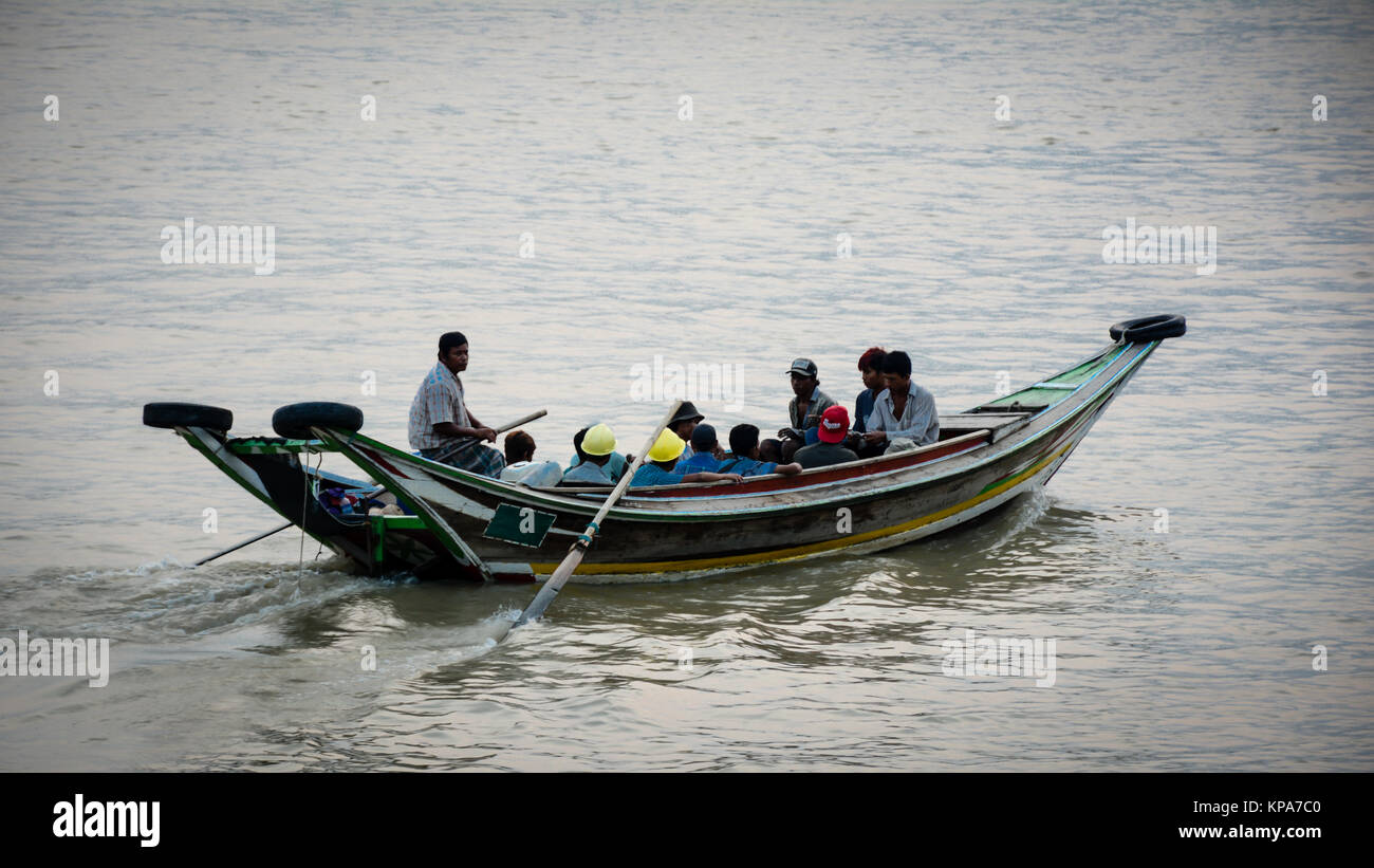 boat passengers in Hlaing river, they are going to opposite site of ...