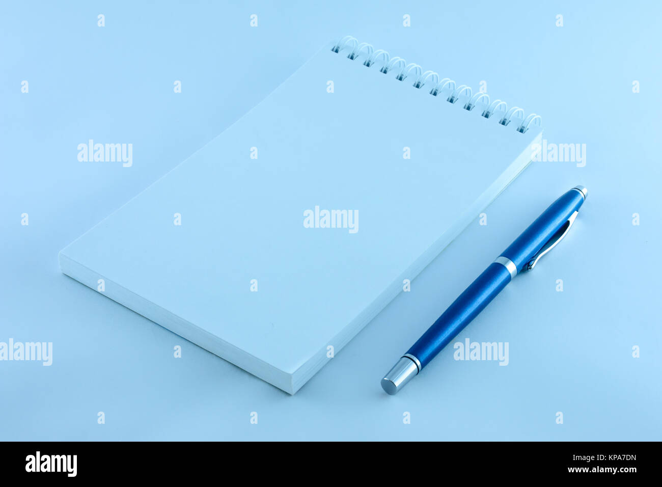 notepad and blue pen to record Stock Photo - Alamy