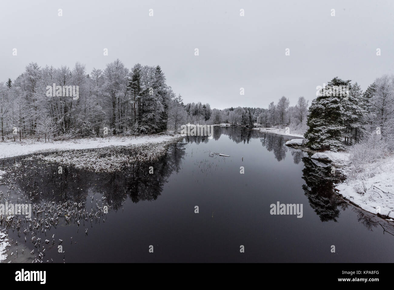 A snowy landscape overlooking water and ice Stock Photo - Alamy