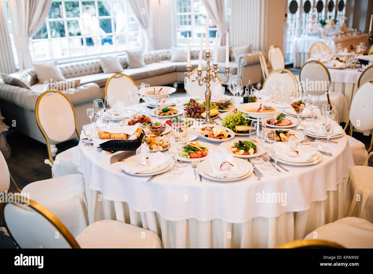 wedding table decorated with flowers and serving in the restaurant ...