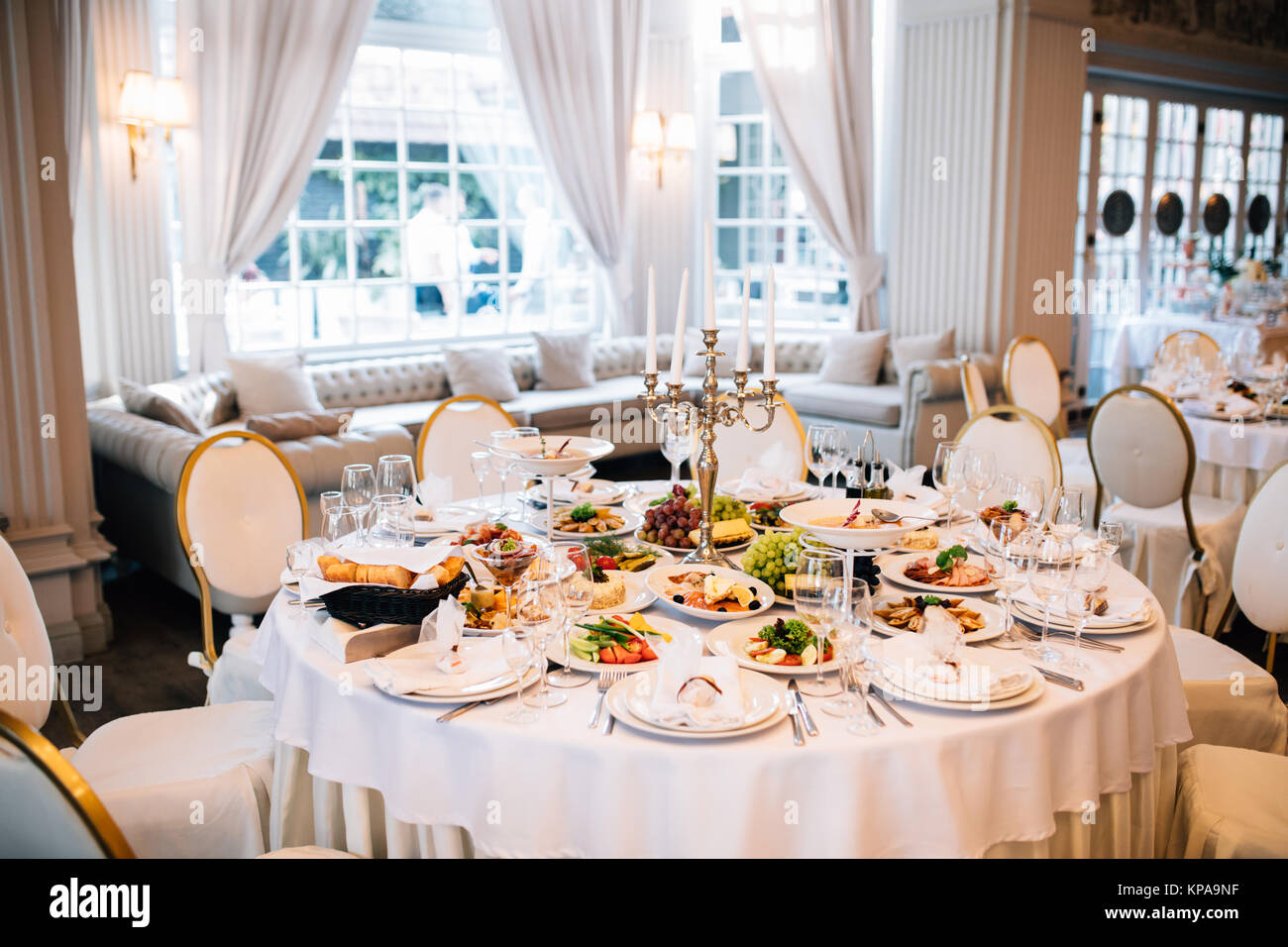 wedding table decorated with flowers and serving in the restaurant ...