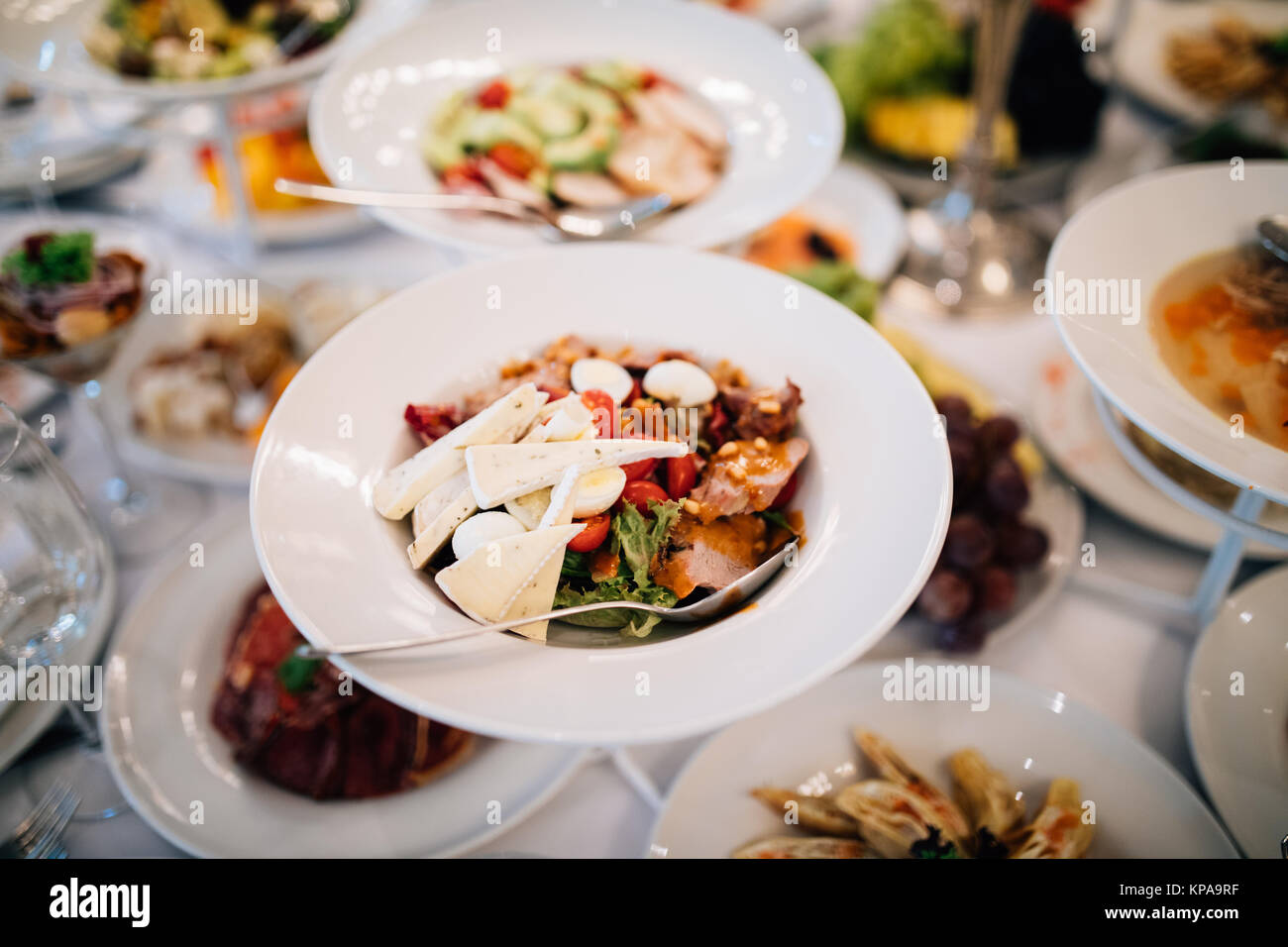 wedding table decorated with flowers and serving in the restaurant ...