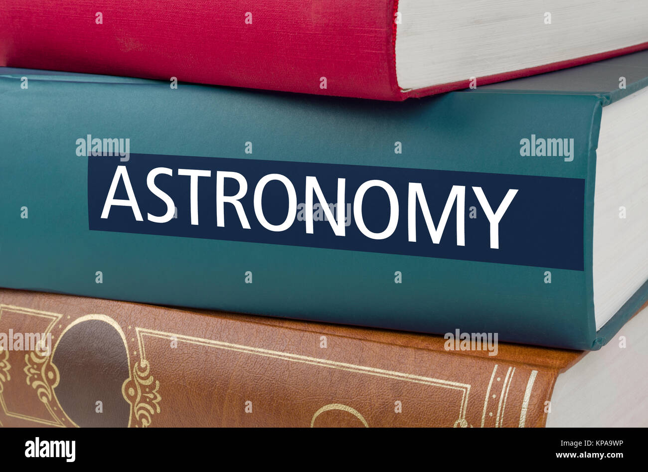 A book with the title Astronomy written on the spine Stock Photo - Alamy