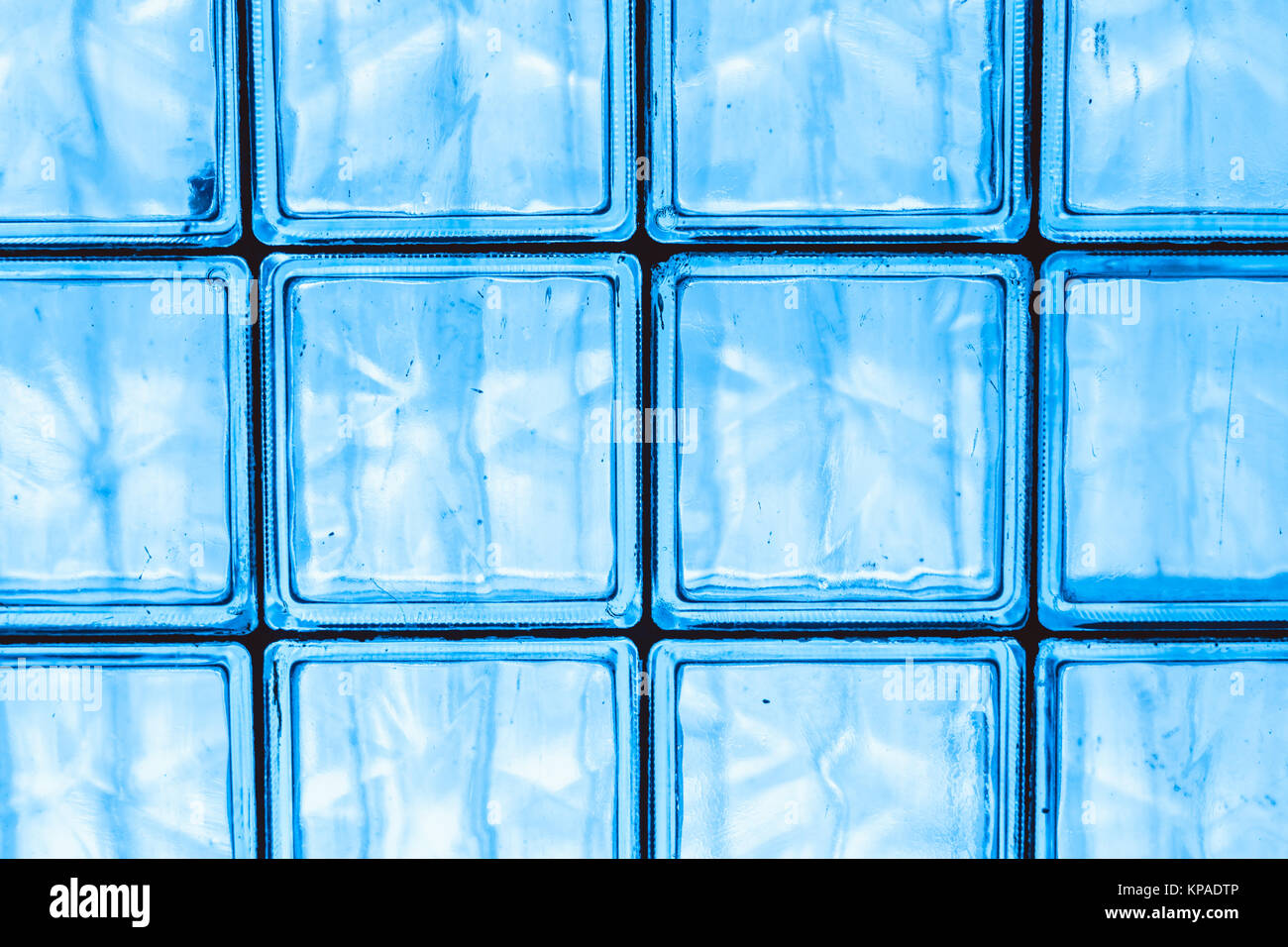Wall of transparant glass tiles serving as colorful window wallpaper ...