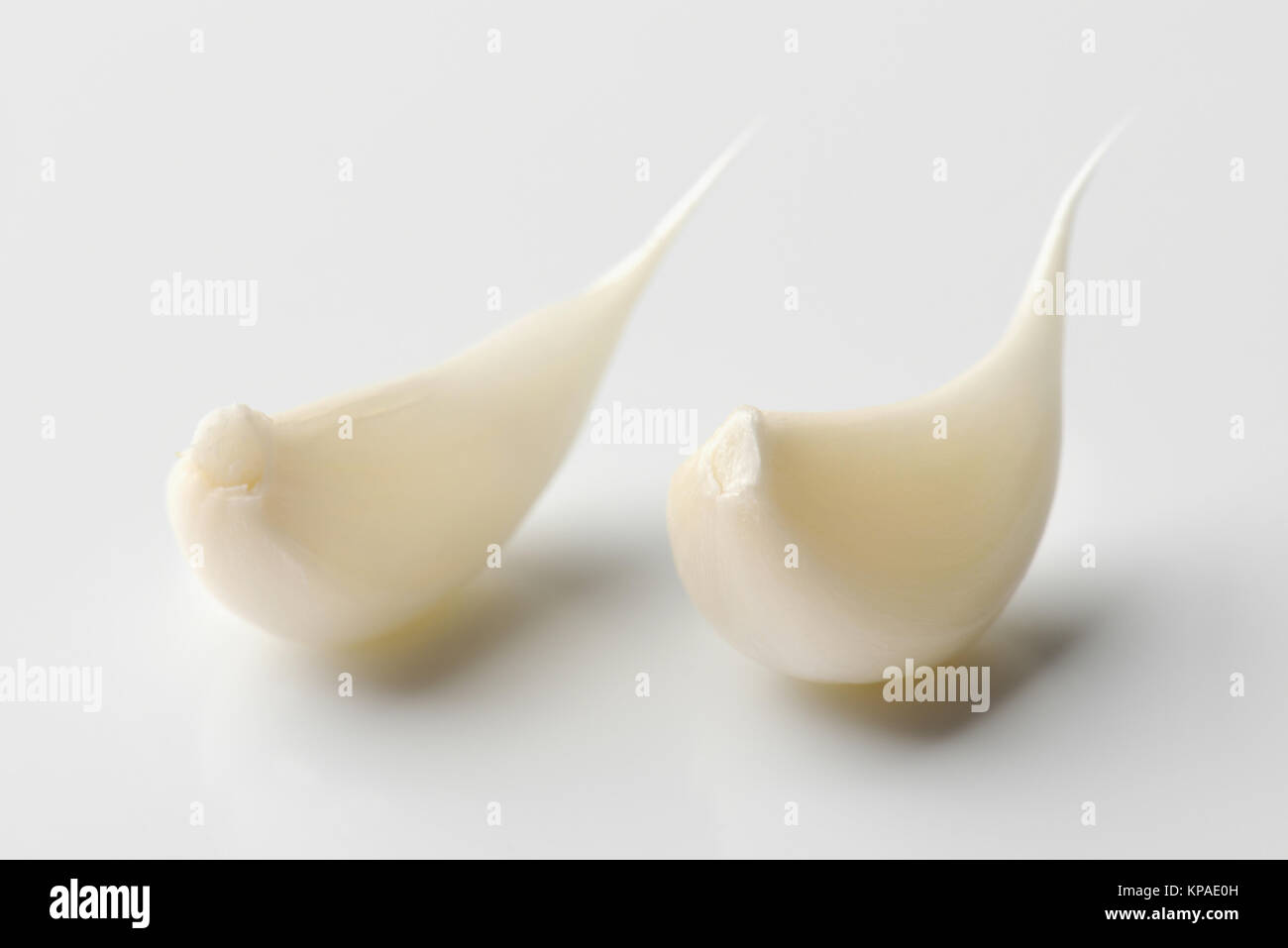 two garlic cloves Stock Photo - Alamy