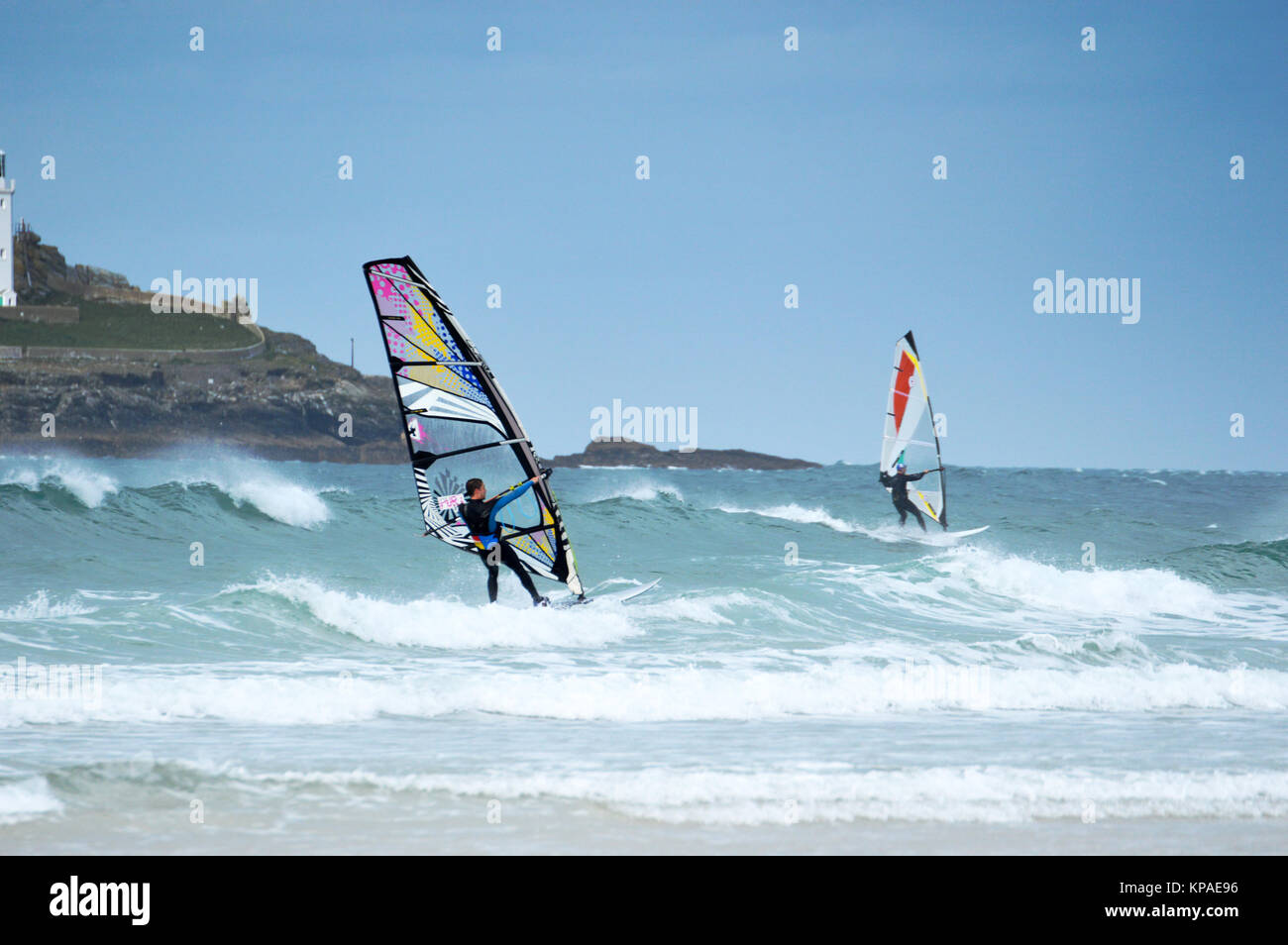 Men windsurfing waves in Gwithian, Cornwall, UK Stock Photo - Alamy