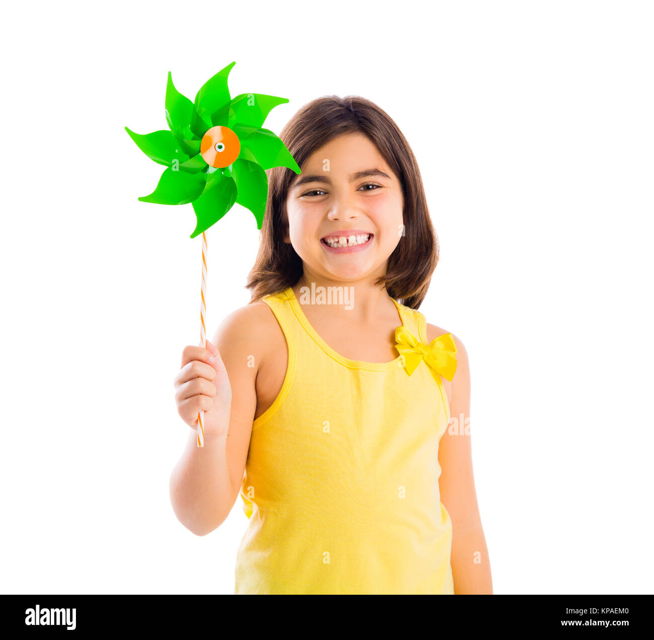 Girl blowing a windmill Stock Photo - Alamy
