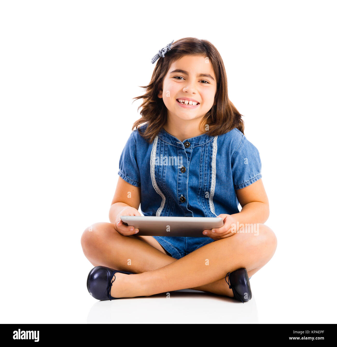 Young girl using a tablet Stock Photo - Alamy