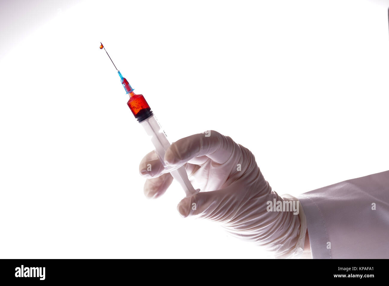 Hand with syringe isolated on white Stock Photo - Alamy
