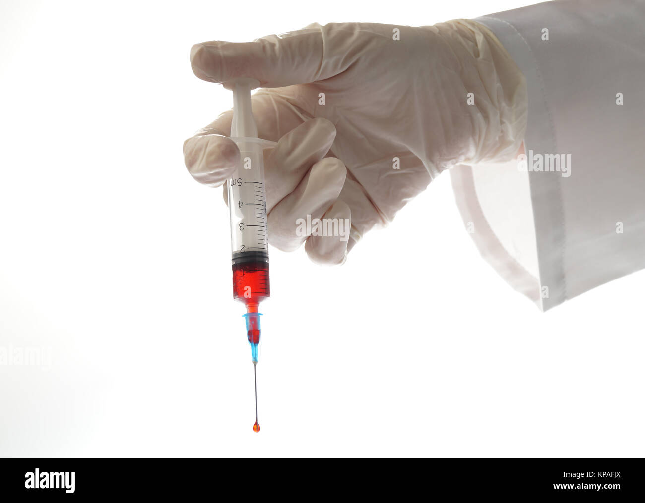 Hand with syringe isolated on white Stock Photo - Alamy