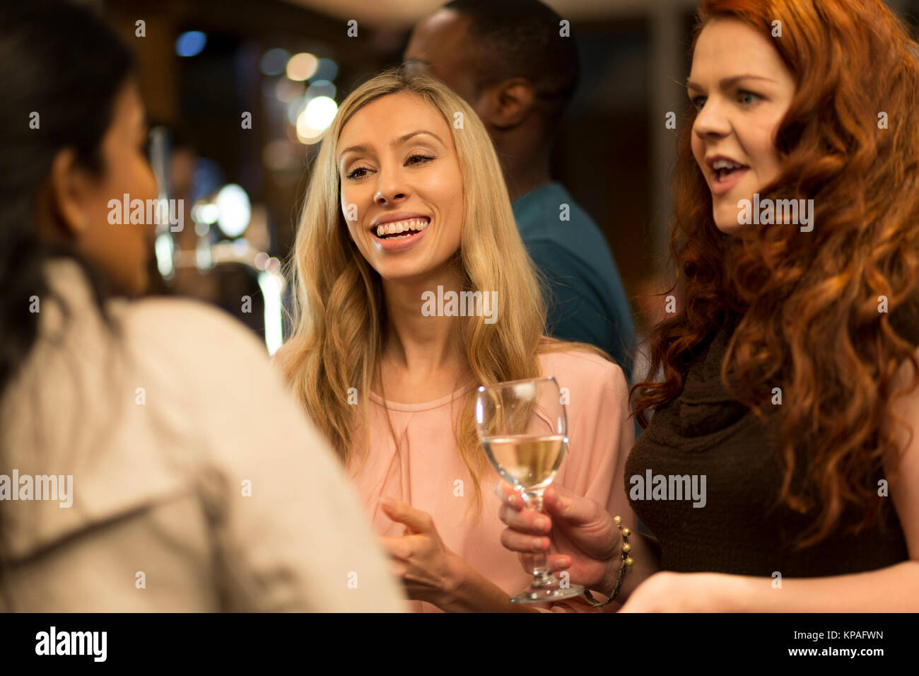 Friends at a bar Stock Photo - Alamy