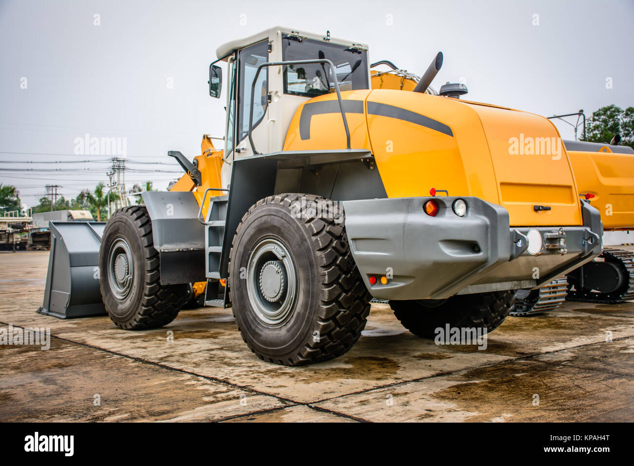 closeup photo of big wheel loader Stock Photo - Alamy
