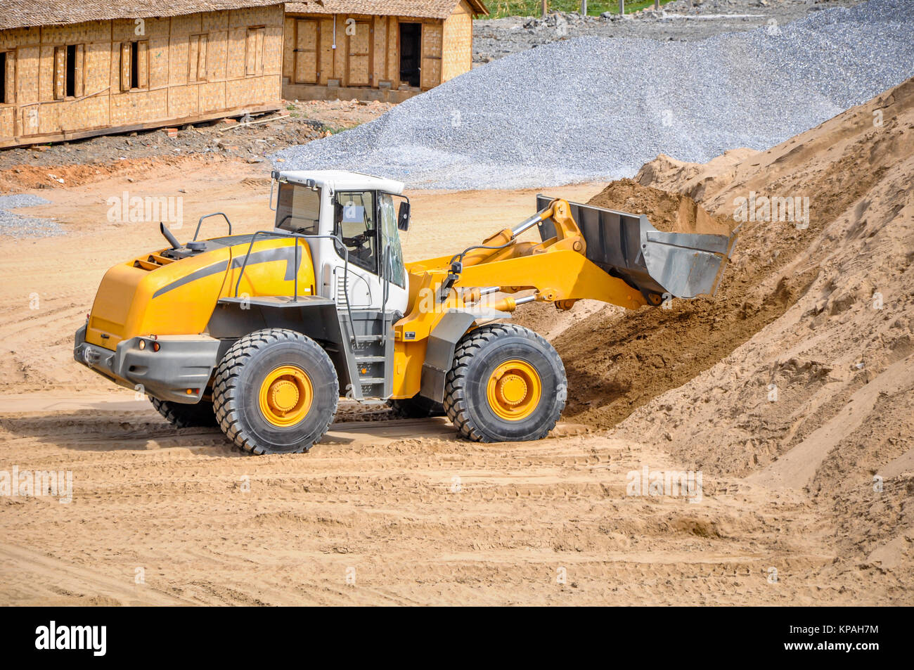 landscape photo of wheel loader in construction site Stock Photo - Alamy