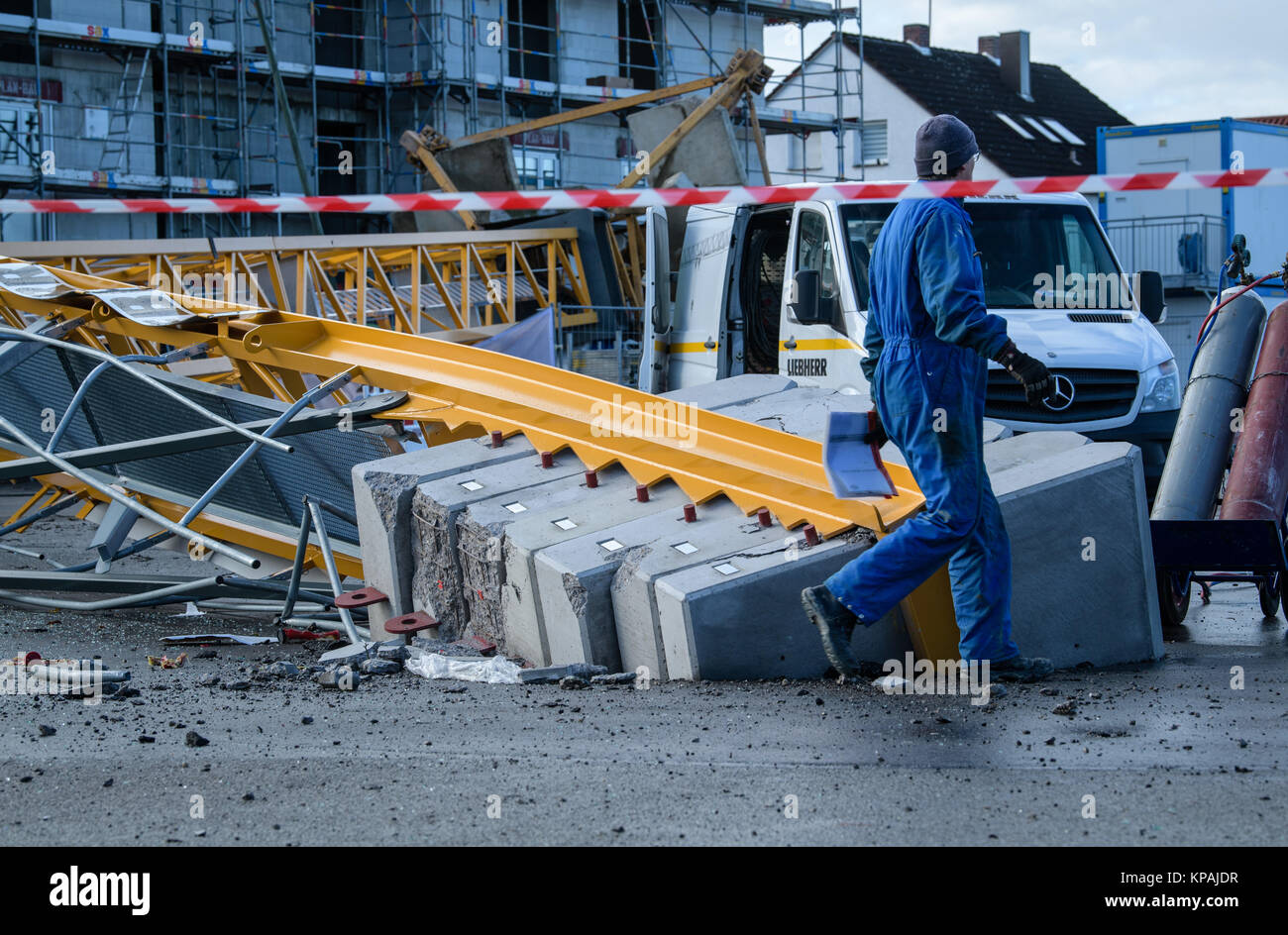 A fallen construction crane can be seen at the construction site of a ...