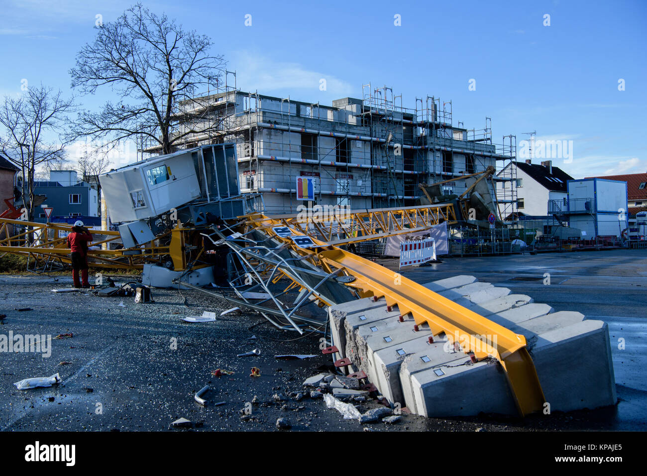 A fallen construction crane can be seen at the construction site of a ...