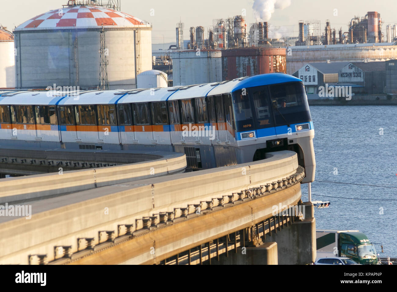 Tokyo Monorail train moves along an elevated track between Haneda ...
