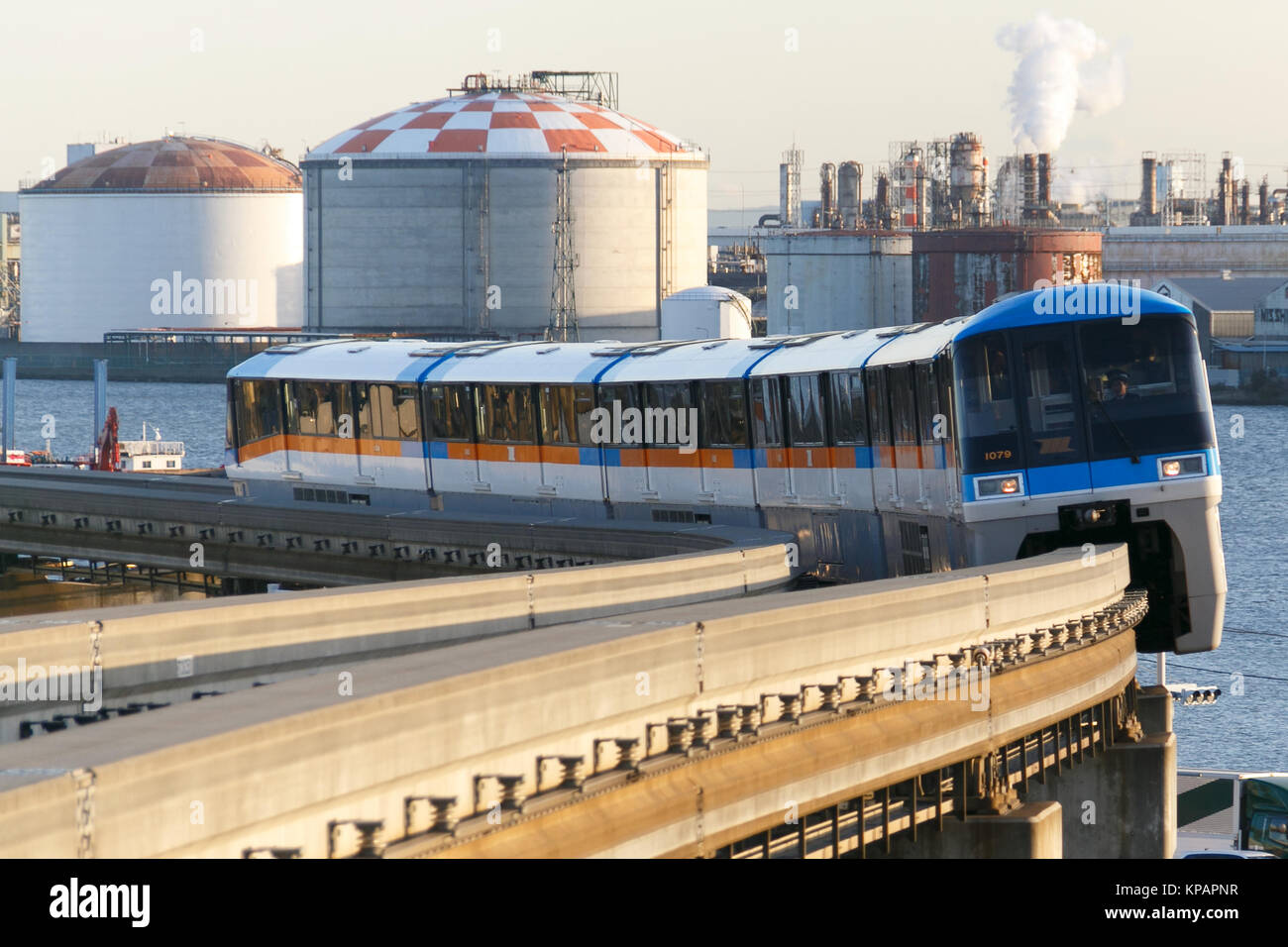 Tokyo Monorail train moves along an elevated track between Haneda ...
