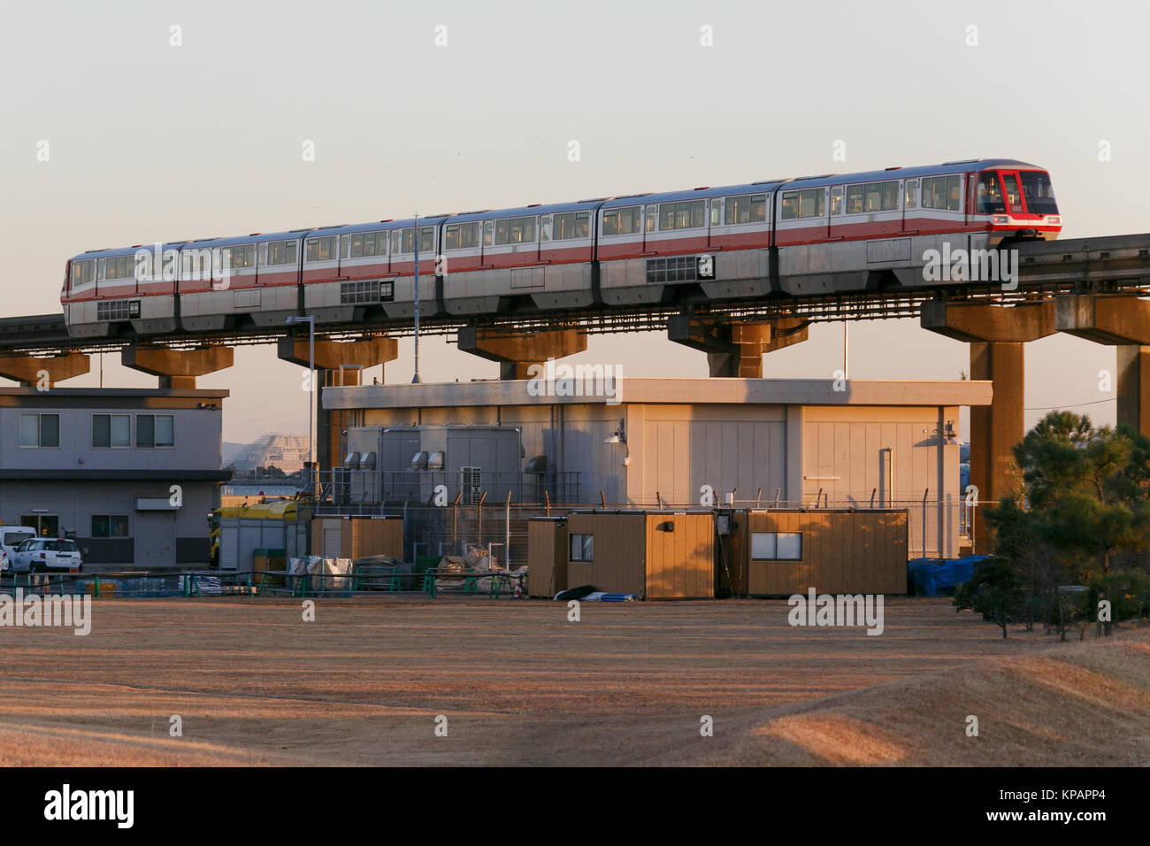 Tokyo Monorail train moves along an elevated track between Haneda ...