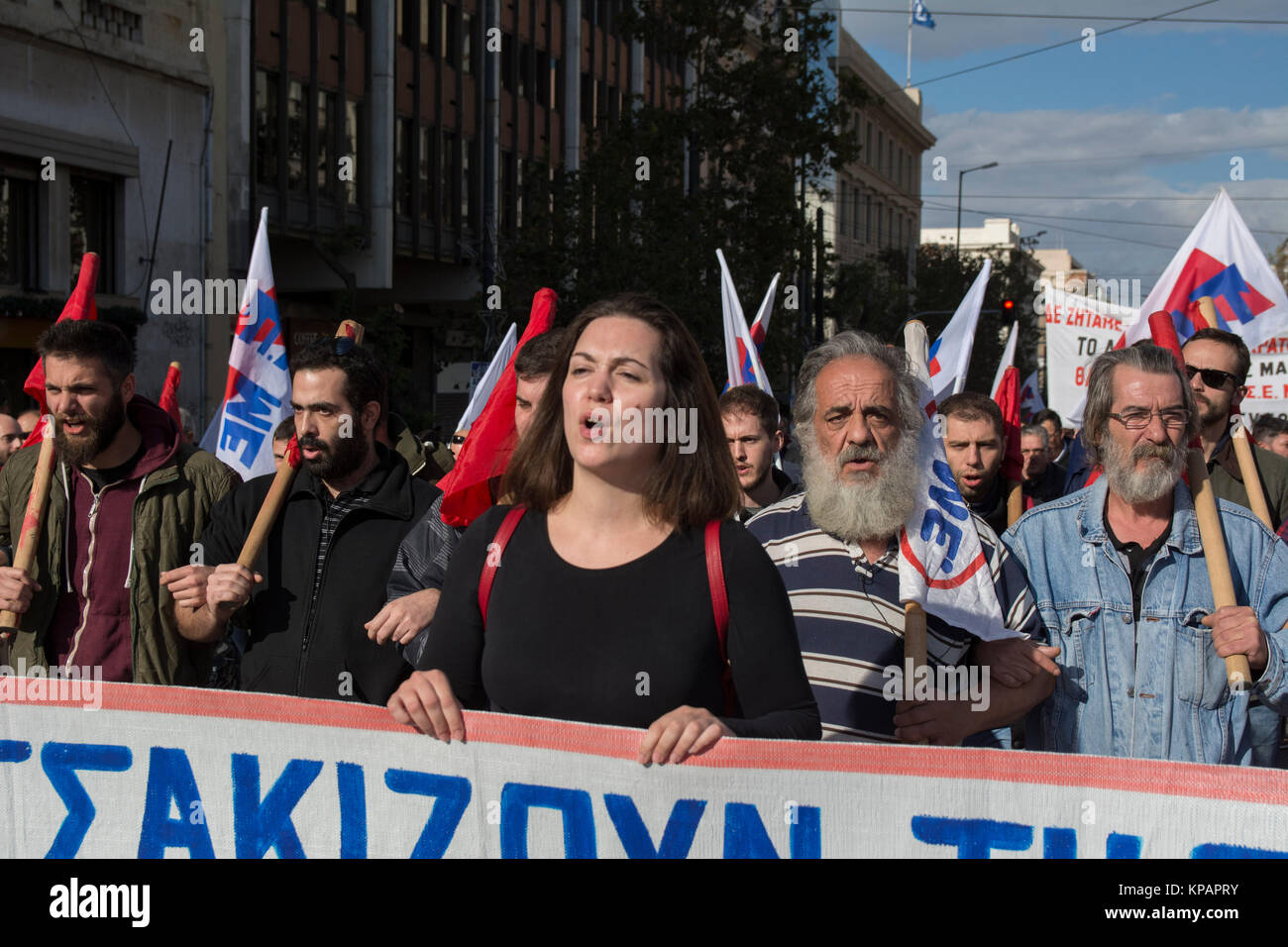 Strikers march holding banners and shouting slogans defending the right ...