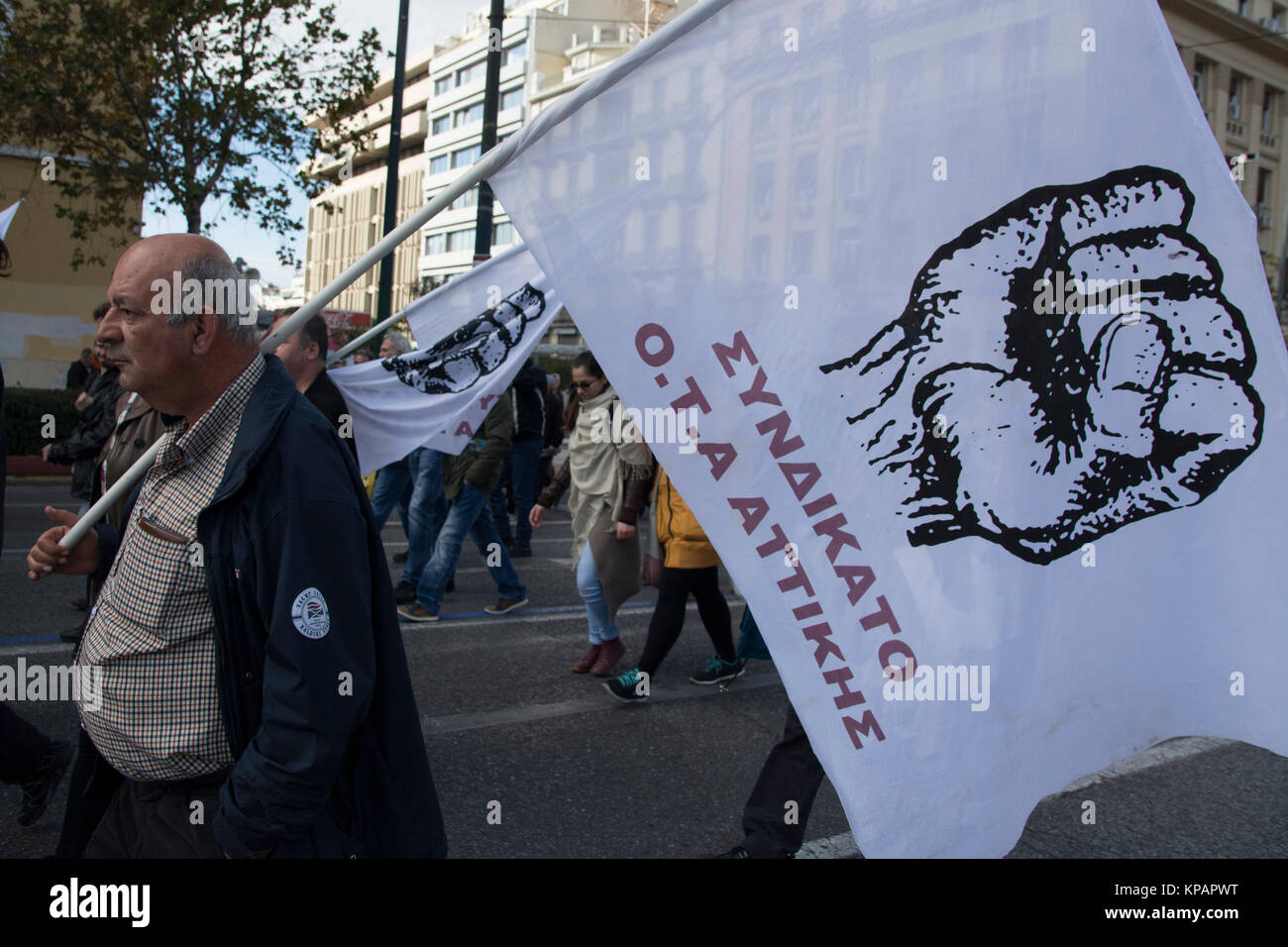 Strikers march holding banners and shouting slogans defending the right ...