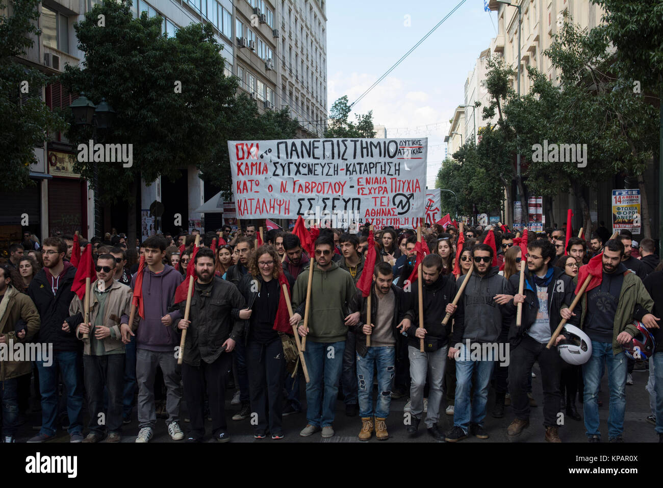 Strikers march holding banners and shouting slogans defending the right ...