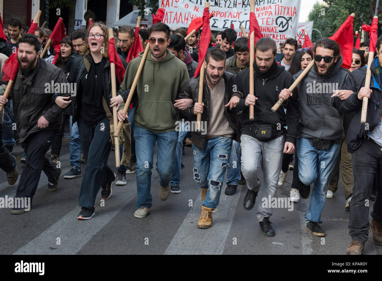 Strikers march holding banners and shouting slogans defending the right ...