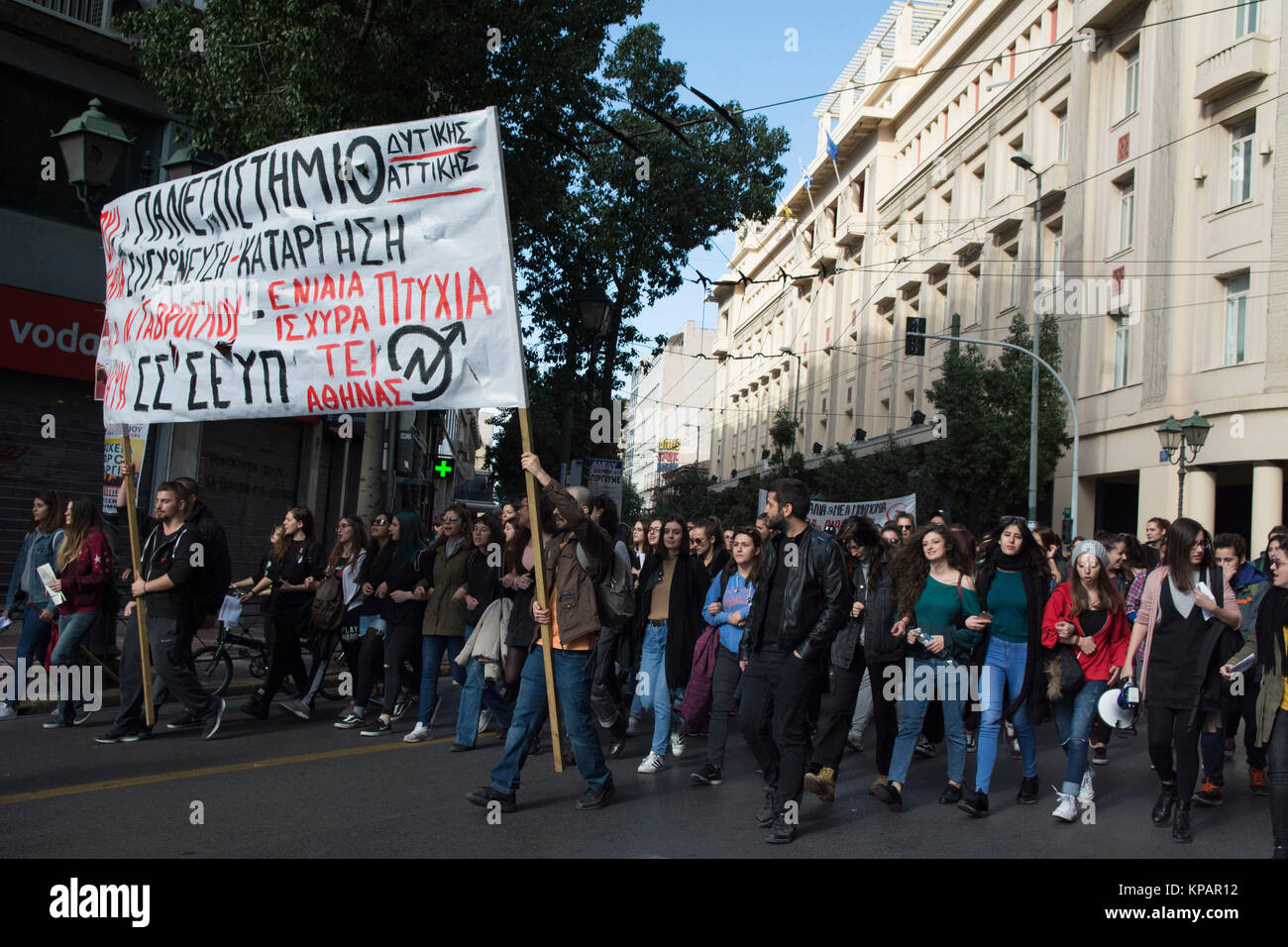 Strikers march holding banners and shouting slogans defending the right ...