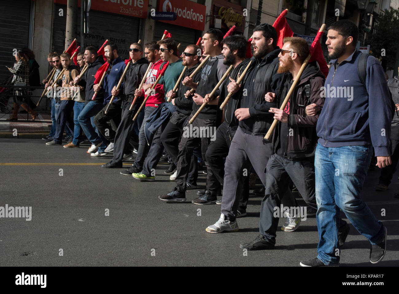 Strikers march holding banners and shouting slogans defending the right ...