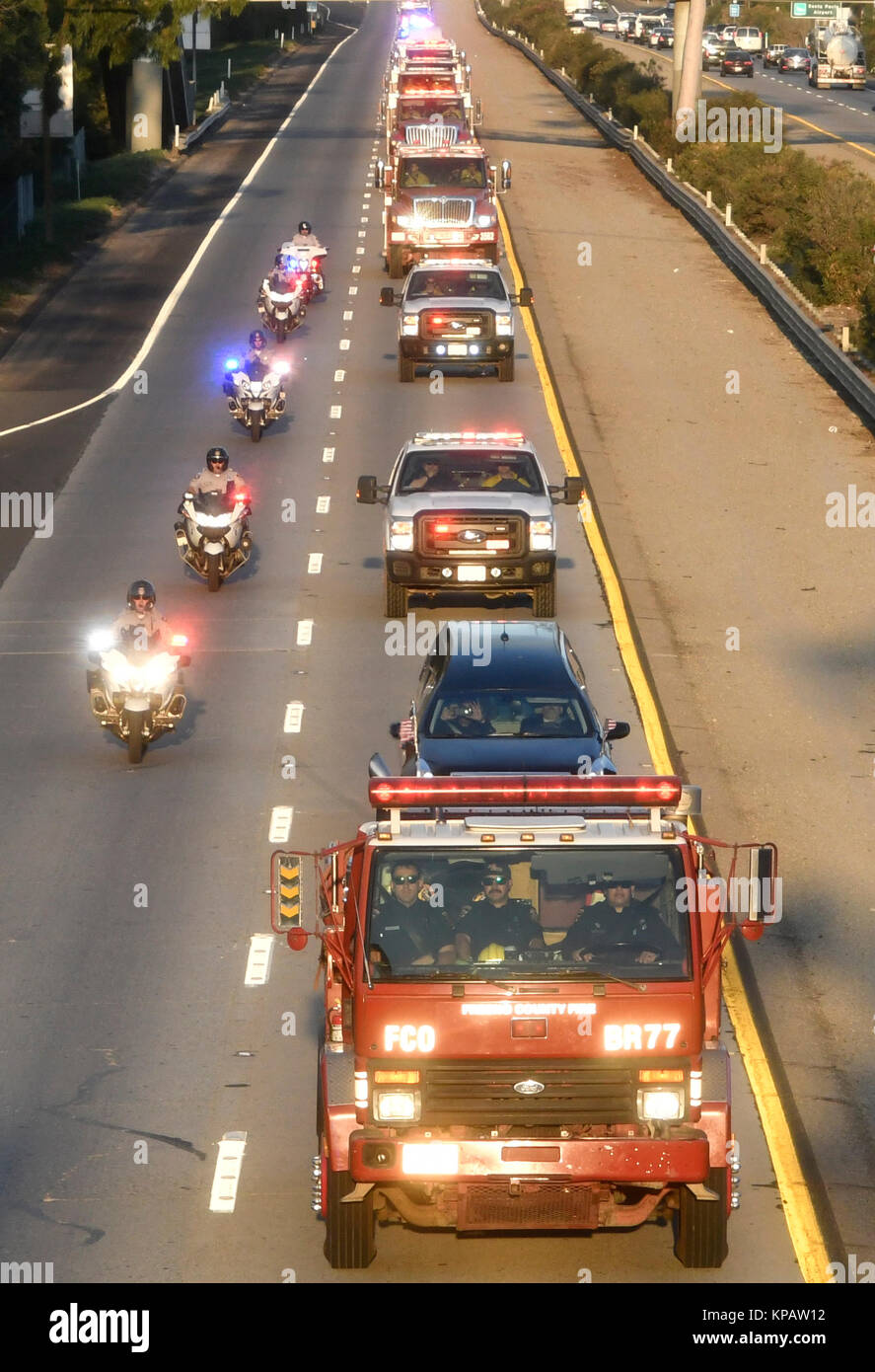 A funeral procession by firefighters and police was done as the people ...