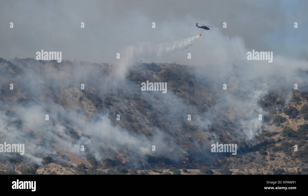 Firefighters battle the east flank of the Thomas fire after a ...