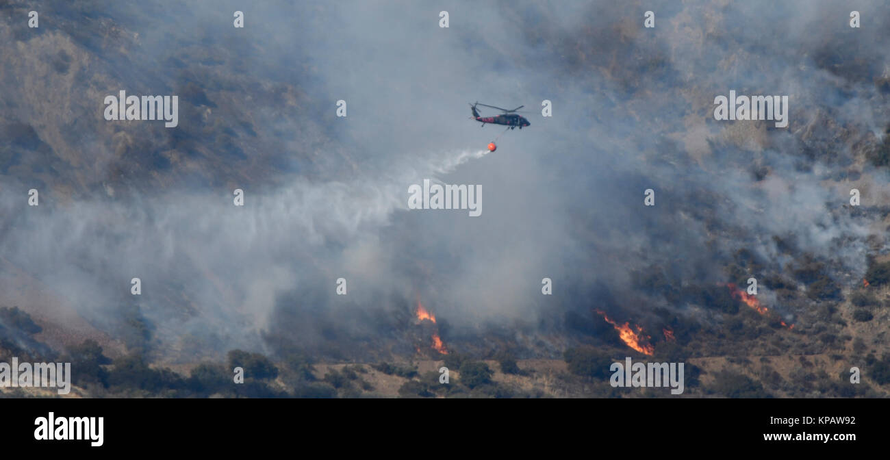 Firefighters battle the east flank of the Thomas fire after a ...