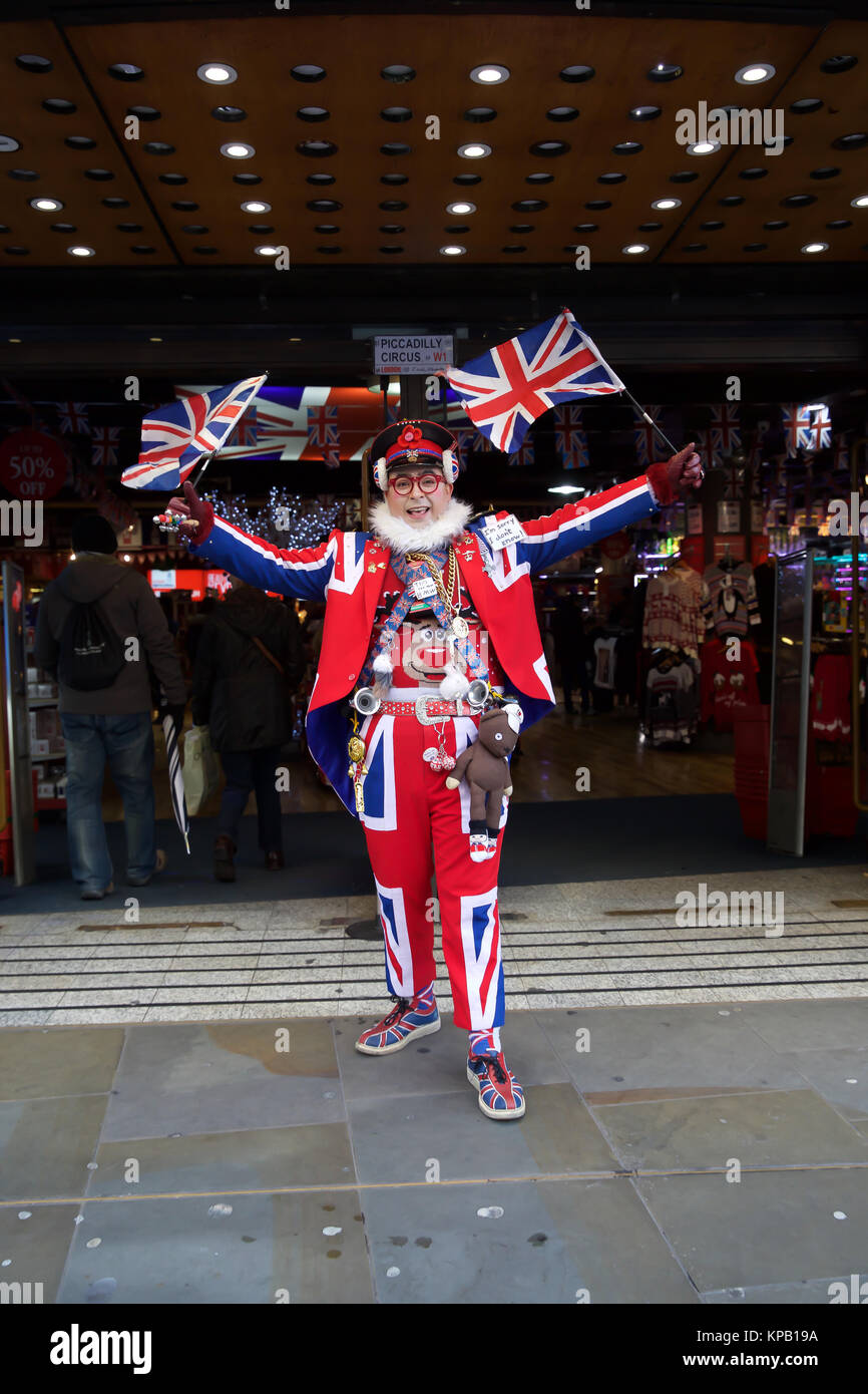 London, UK. 15th Dec, 2017. A man dressed in a Union Jack jumps and ...