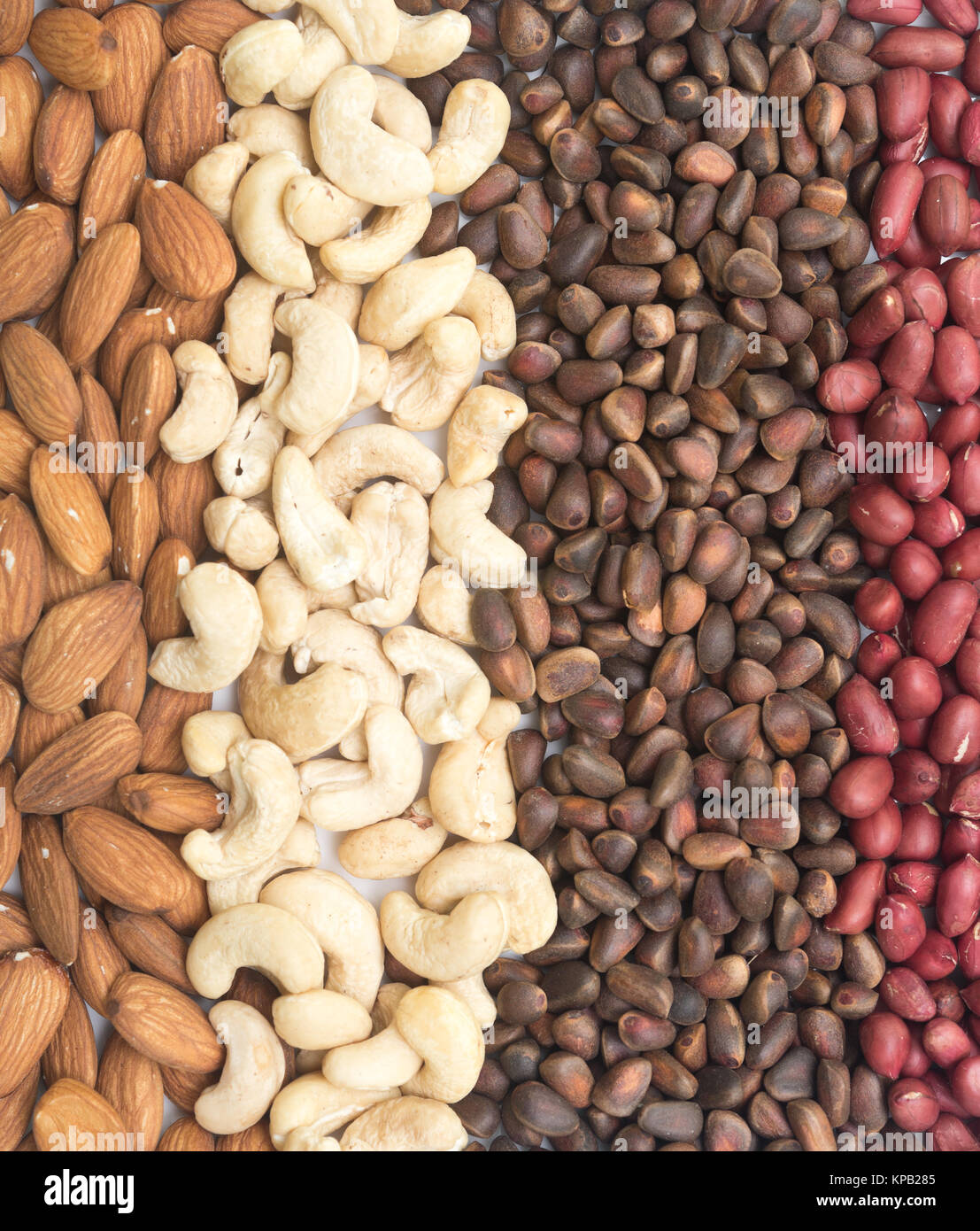 mixed nuts as a background Stock Photo - Alamy