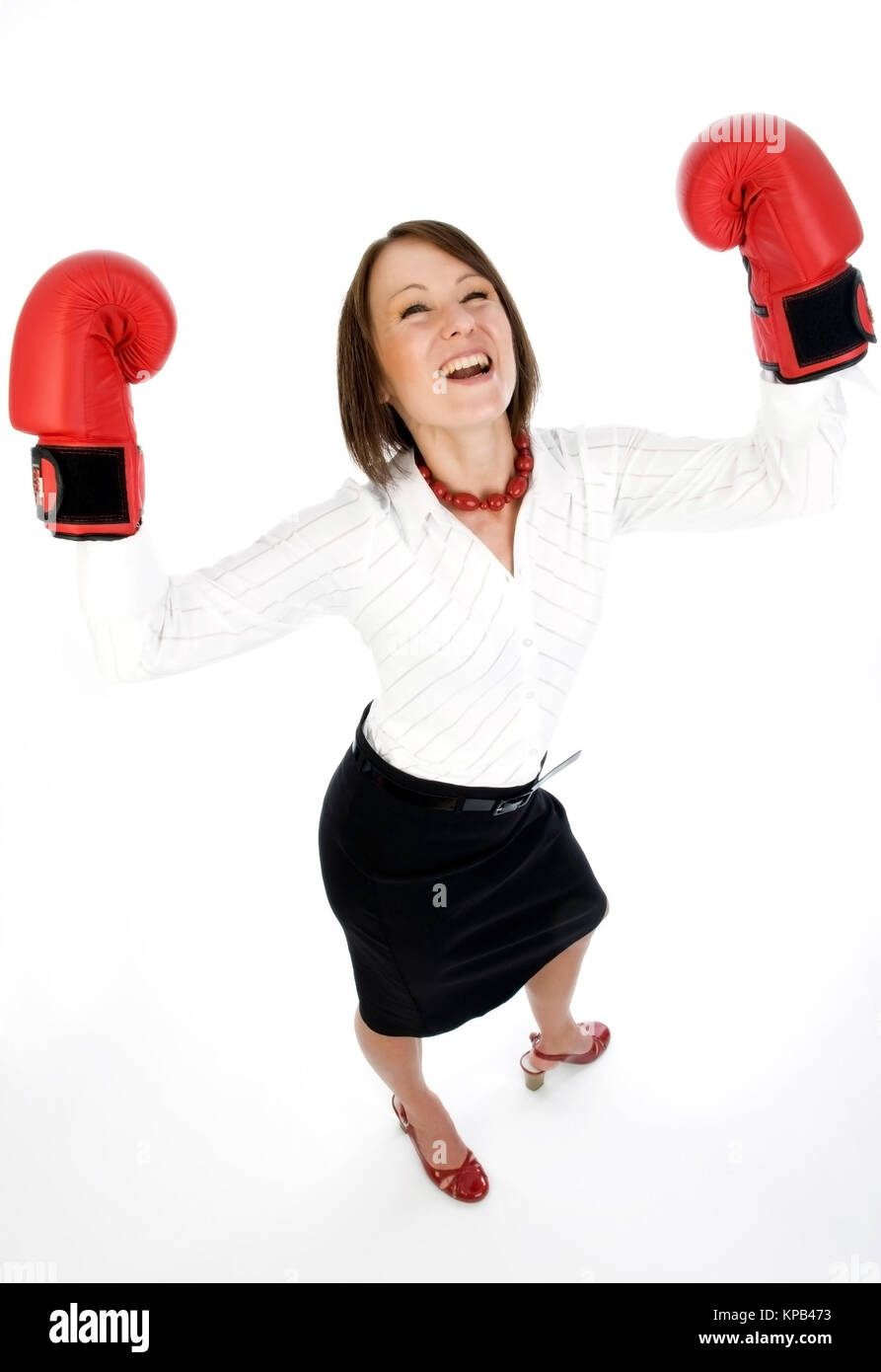 Model release, Junge Geschaeftsfrau mit Boxhandschuhen in Jubelpose ...