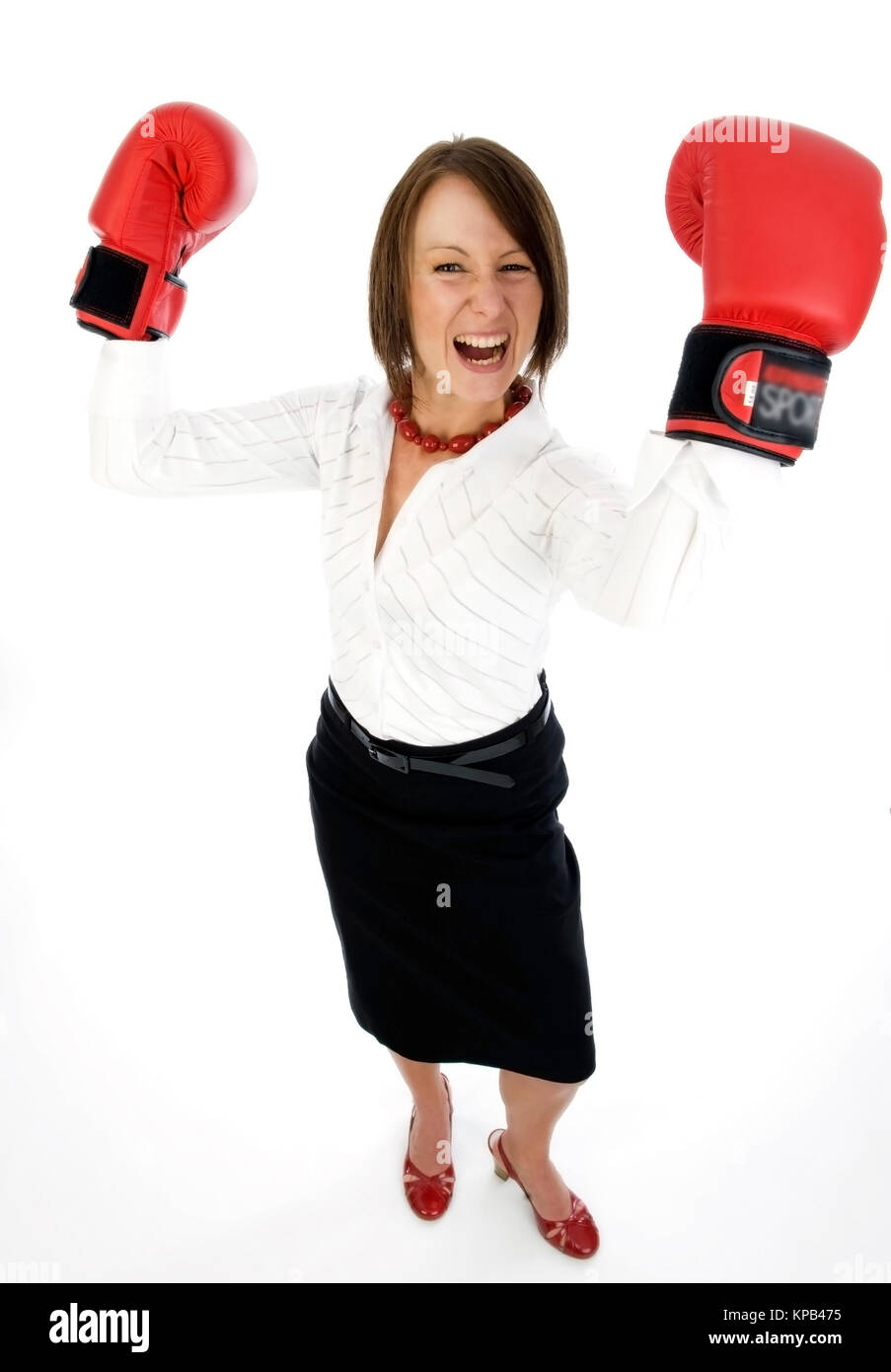Model release, Junge Geschaeftsfrau mit Boxhandschuhen in Jubelpose ...