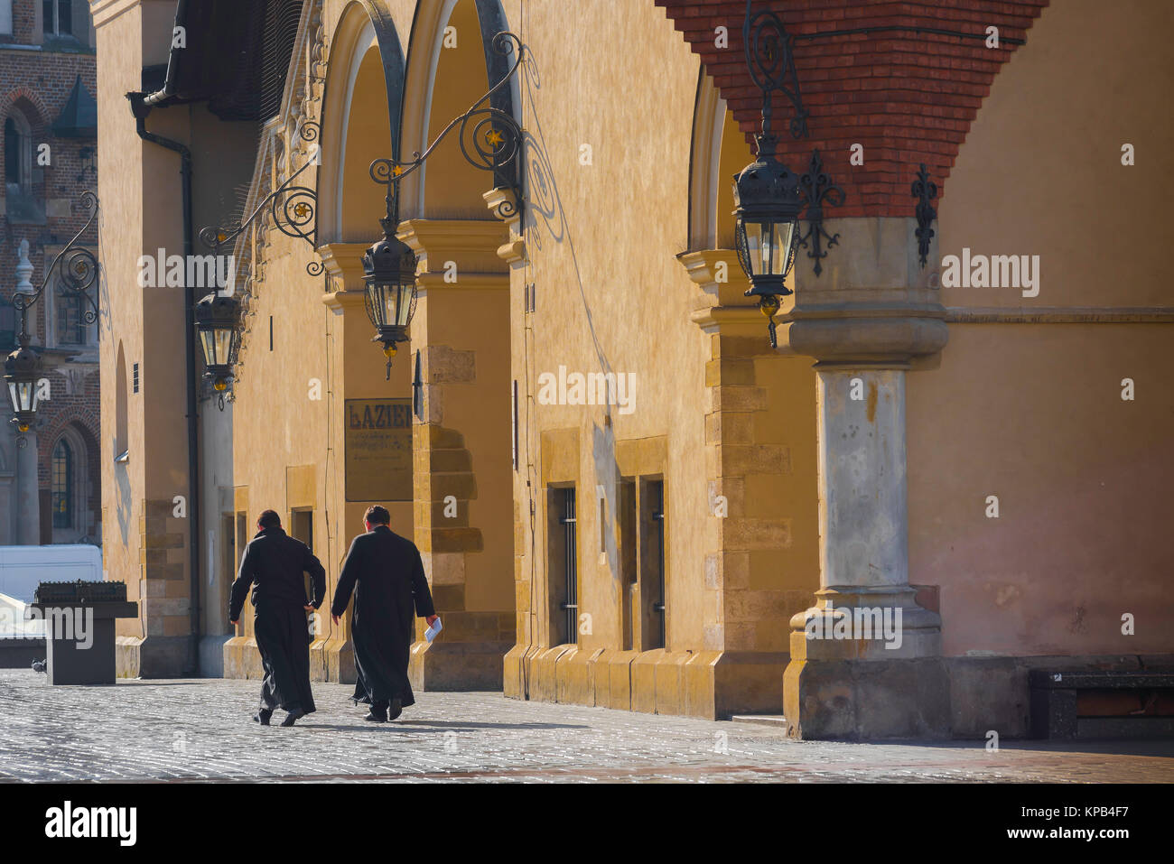 Catholic priests walking, rear view of two priests walking through the ...