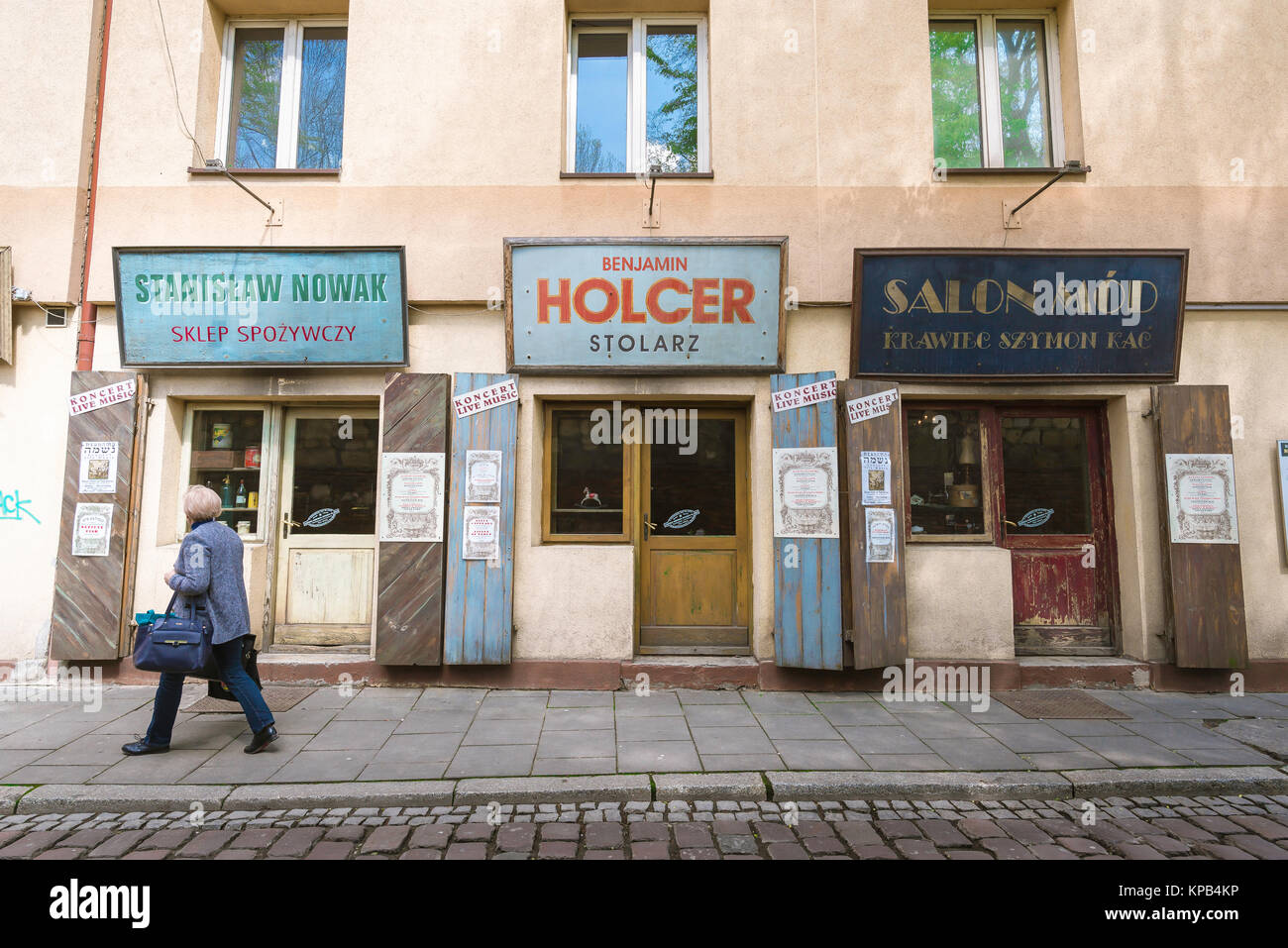 Kazimierz Krakow street, a row of 1940s period-style shop fronts in the ...