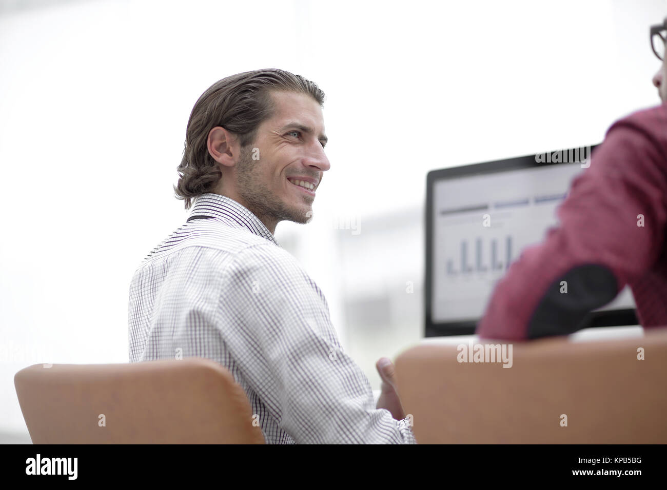 smiling employee talking with a colleague Stock Photo - Alamy