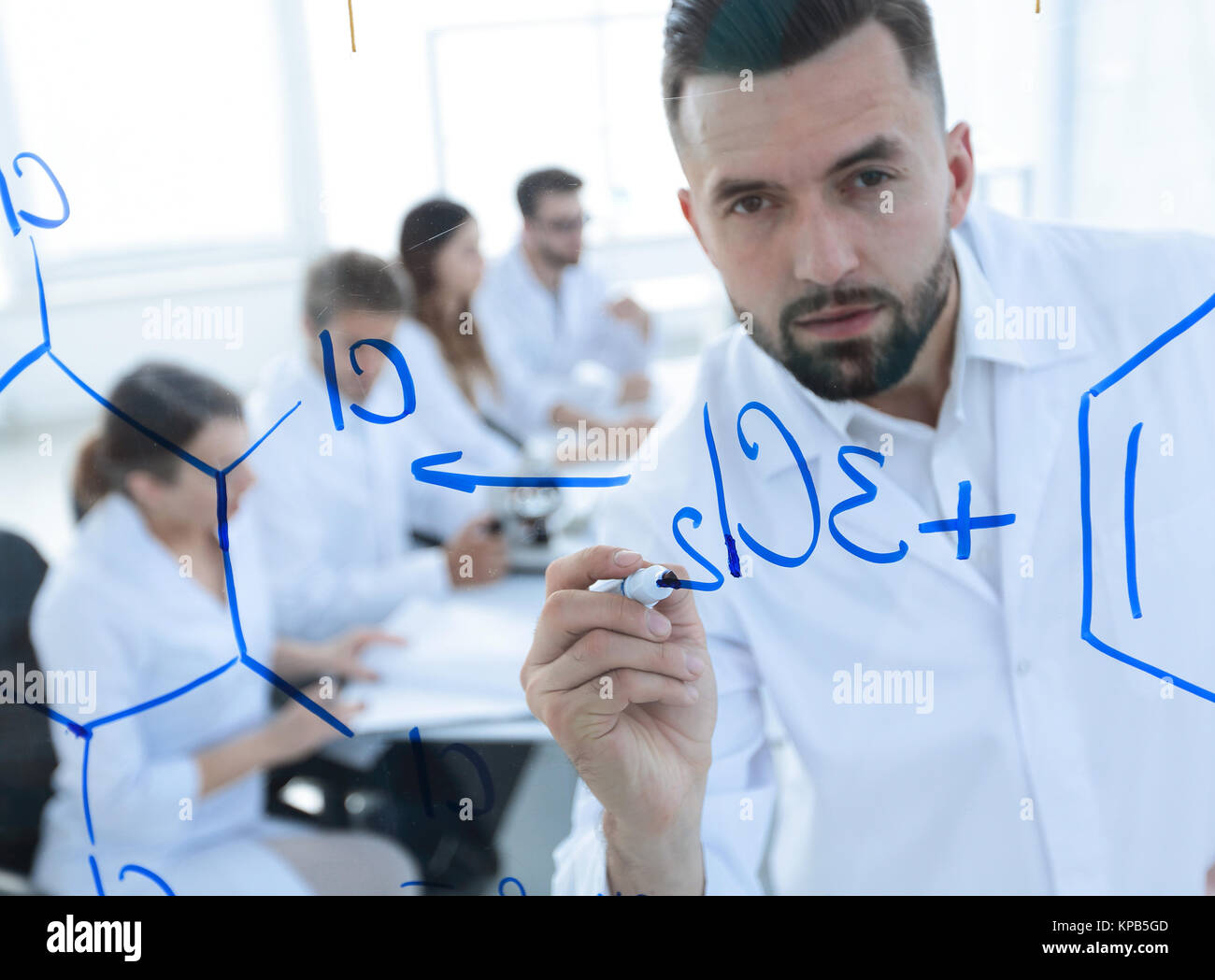 closeup of a serious scientist working with formulas Stock Photo - Alamy
