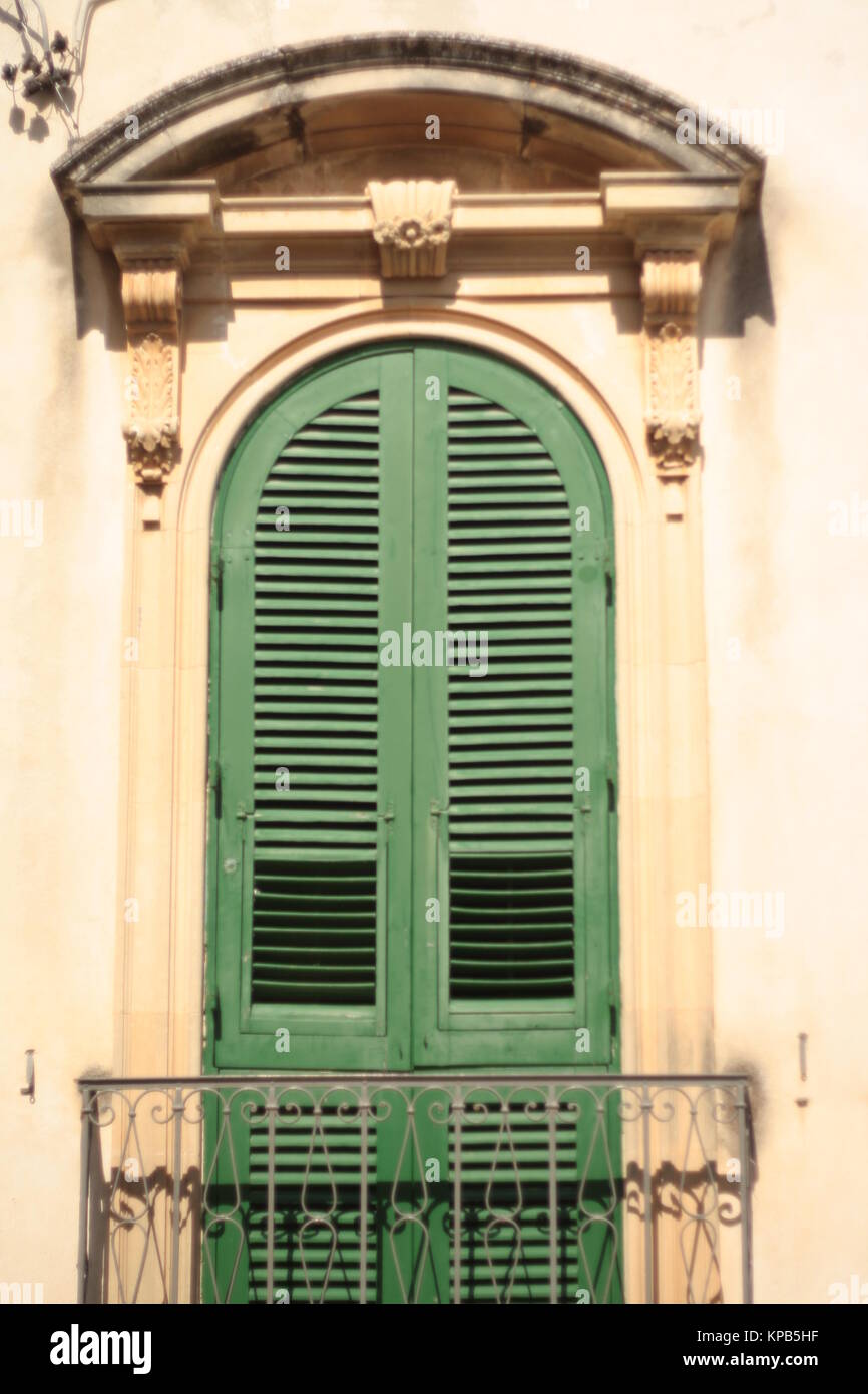 Green window frames in Otranto old town, Italy Stock Photo - Alamy