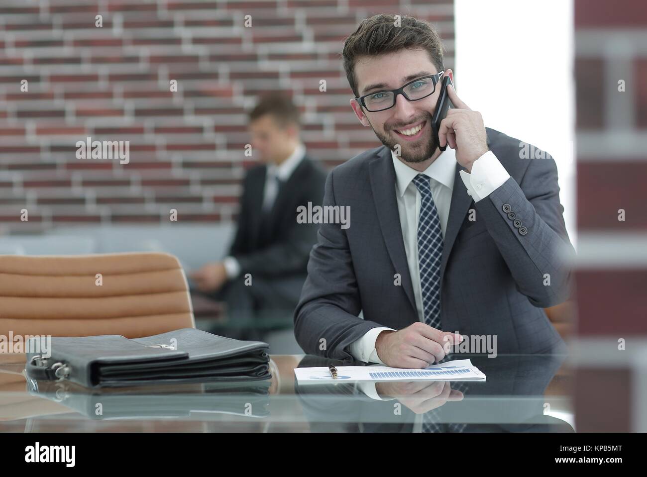 financial Manager sitting at his working place Stock Photo - Alamy