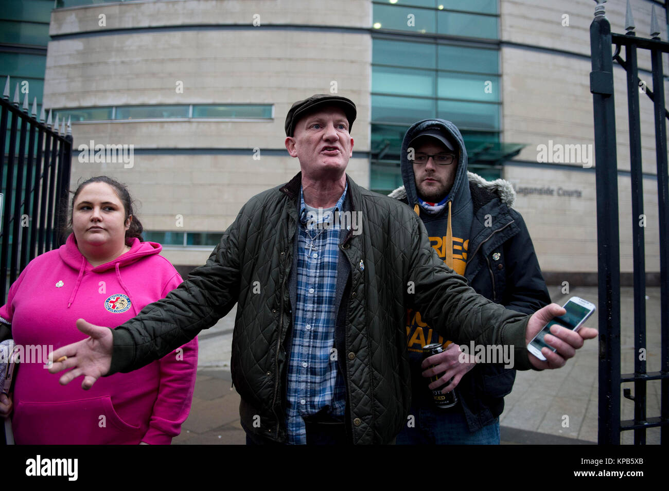 Andrew Edge (centre) speaking to the media outside Laganside courts in ...
