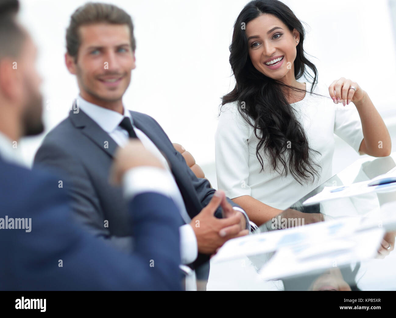 business people communicate at work their Desk Stock Photo - Alamy