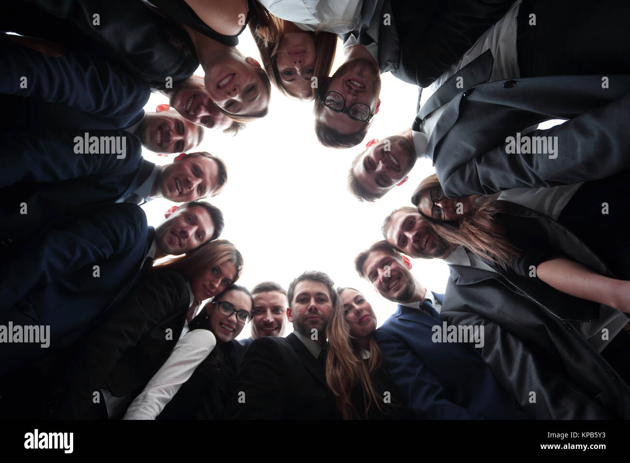 large business team is forming a circle and looking at the camera Stock ...