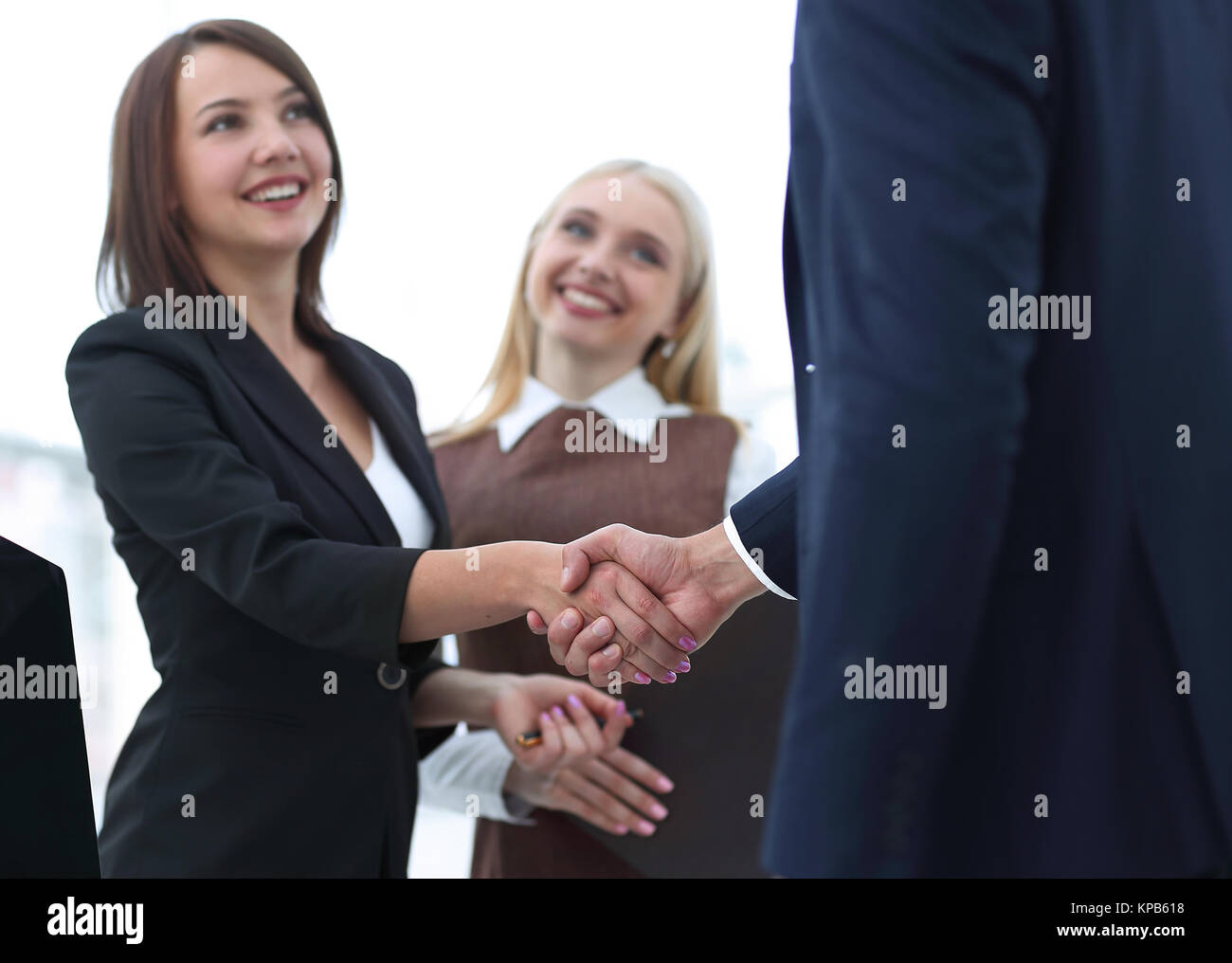 business colleagues shaking hands after a successful presentation Stock ...