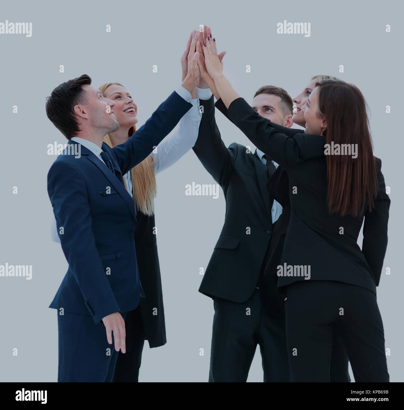 Business team showing unity with their hands together Stock Photo - Alamy