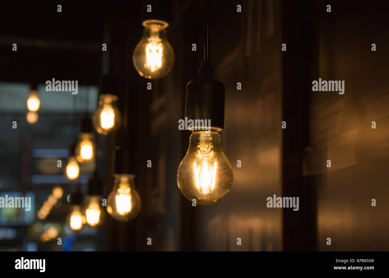 Light bulb on black background Stock Photo - Alamy