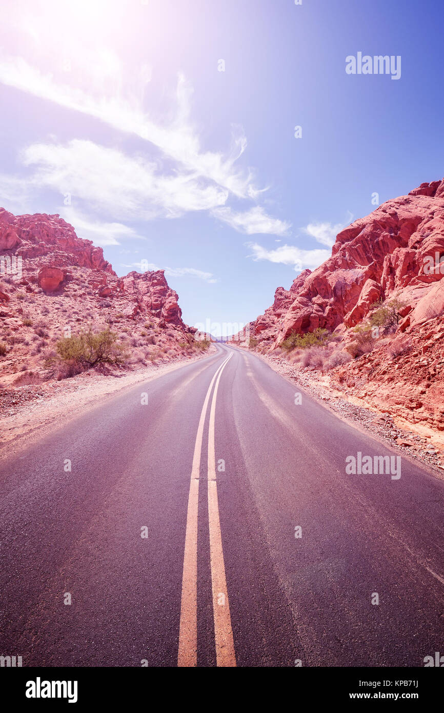 Desert road, travel adventure concept, PANTONE Ultra Violet color toned ...