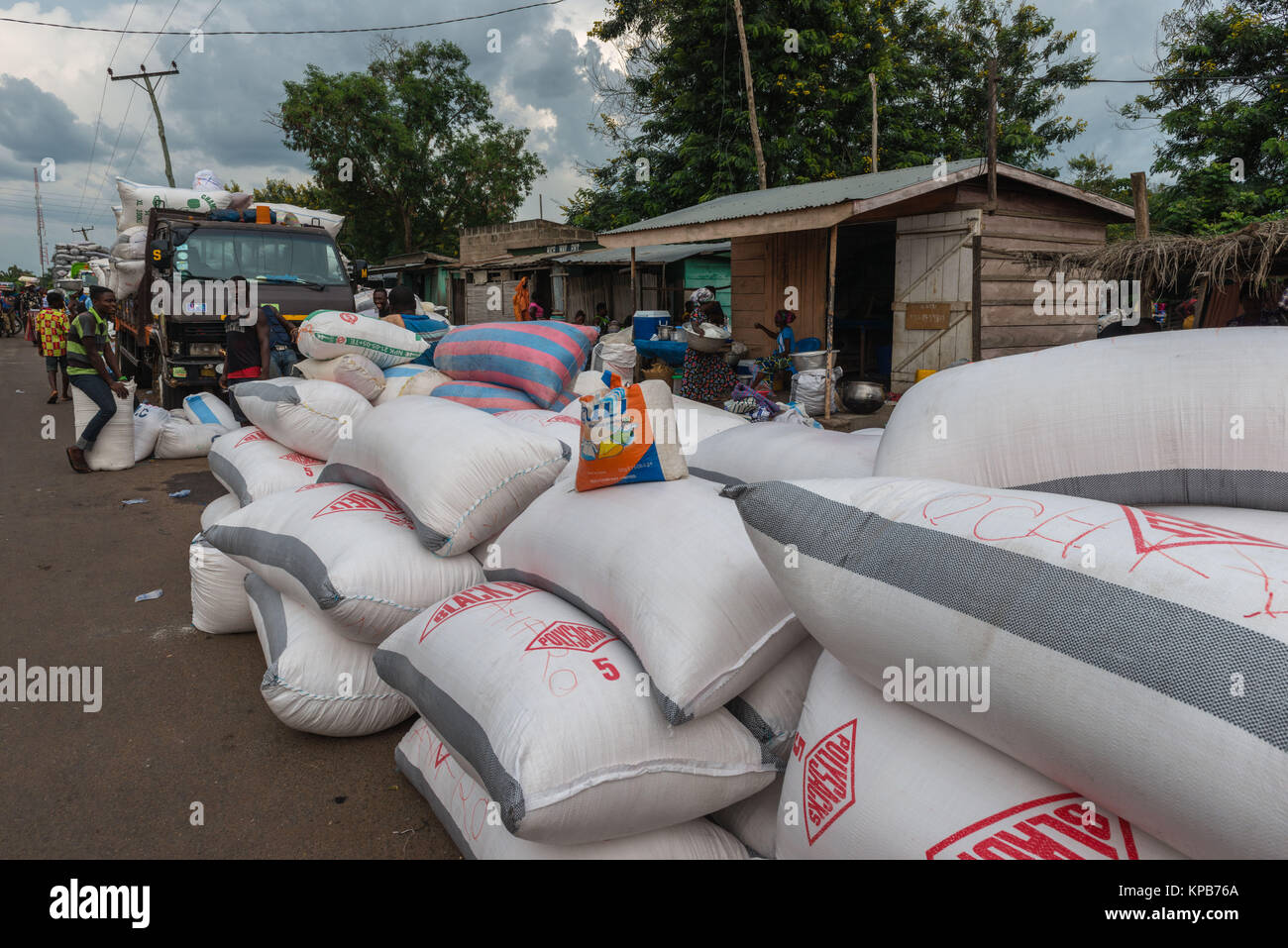 Loading sacks of gari to be transported to different local markets ...
